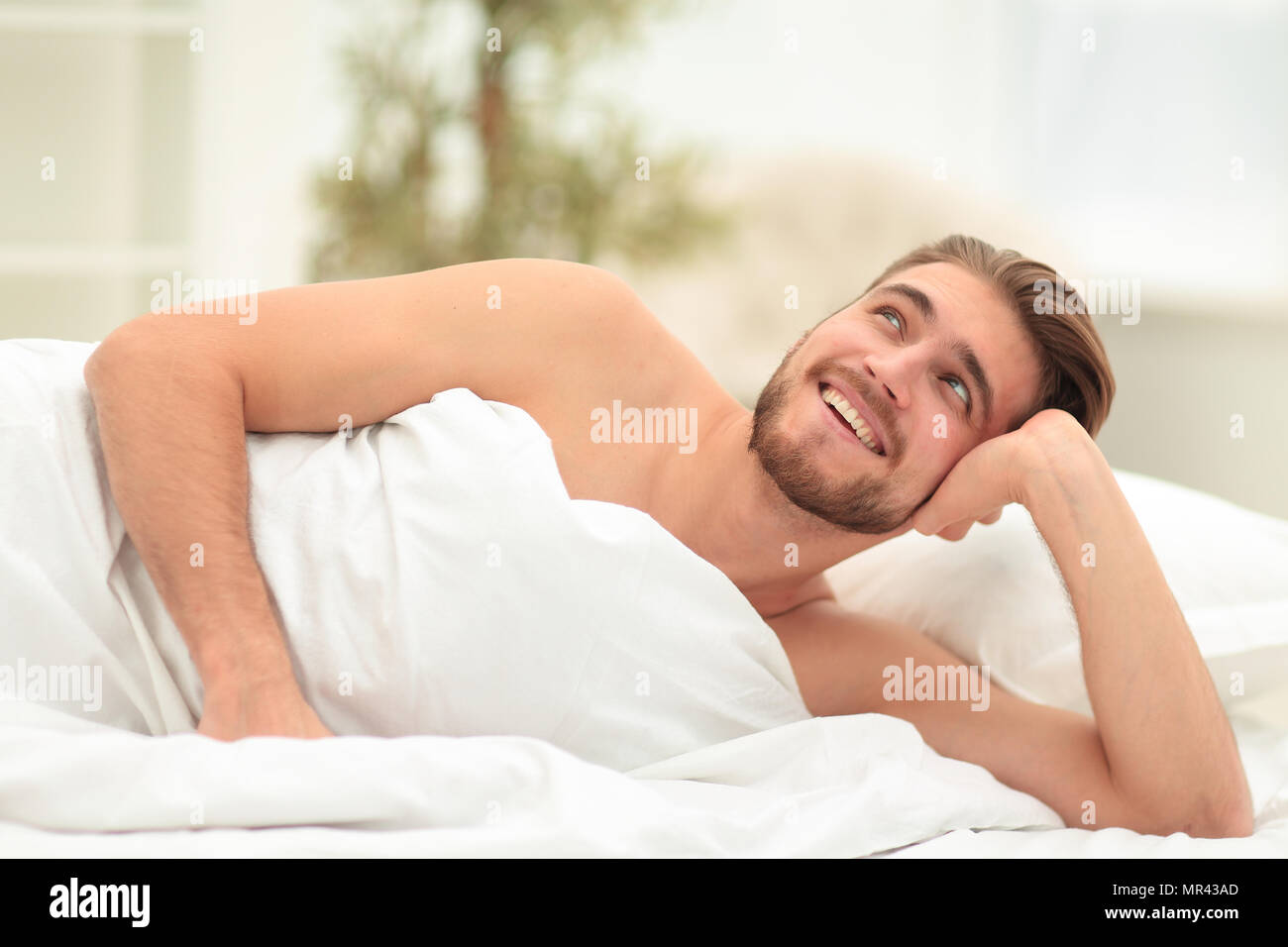 Young man dreams on bed hi-res stock photography and images - Alamy