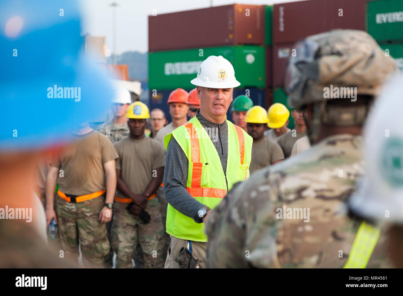 Ben Ruffin briefs U.S. Soldiers before unloading equipment from USNS ...