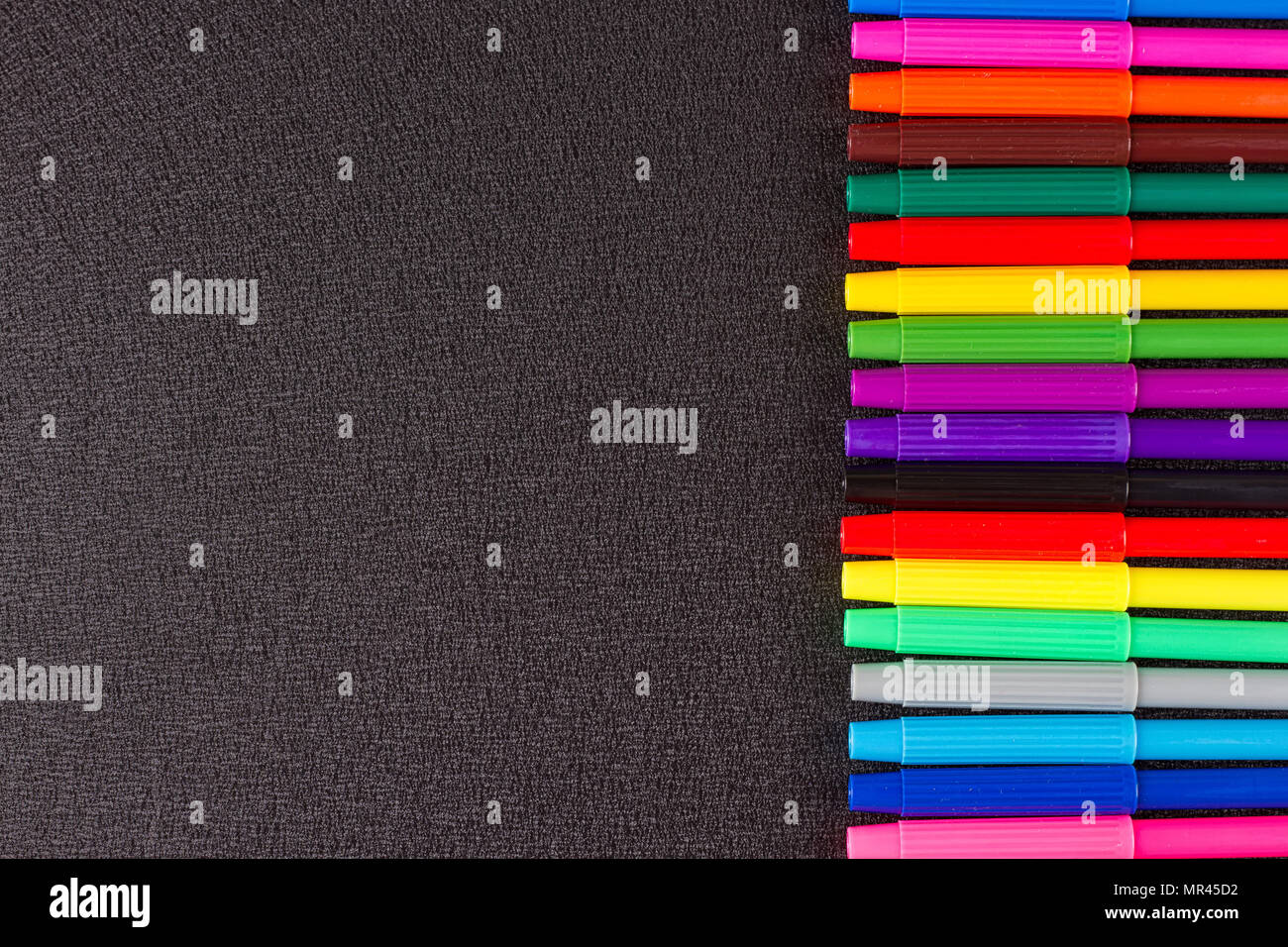 Multy Color pencils on the black background Stock Photo - Alamy