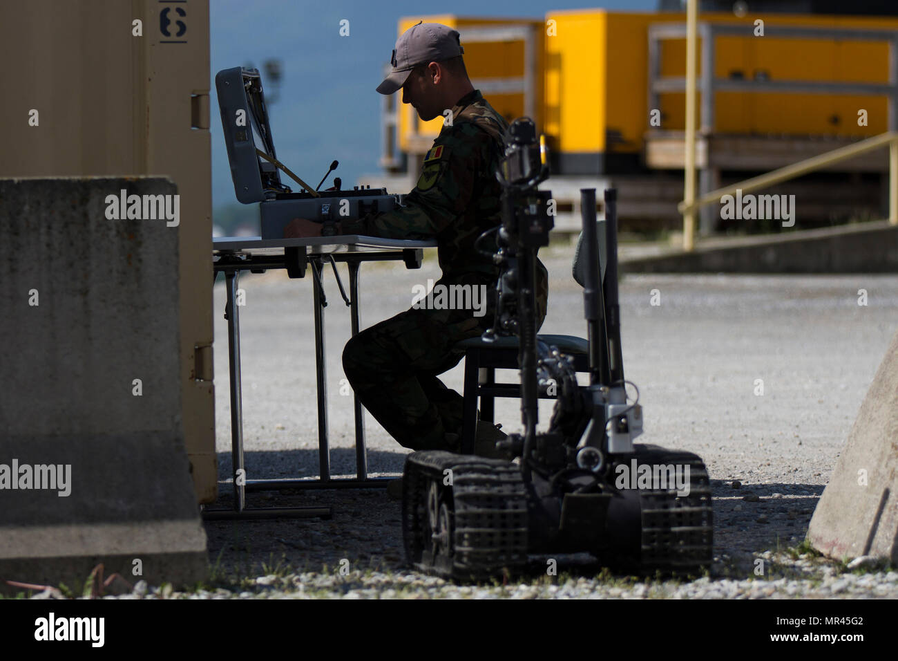 A Moldovan explosive ordnance disposal technician practices piloting a ...