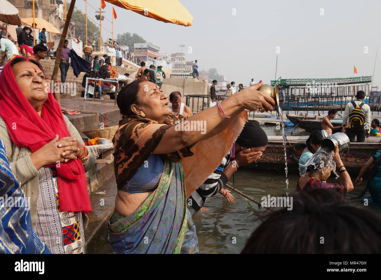 India, Uttar Pradesh, Varanasi, Pilgrims praying at Dashashwamedh Ghat ...