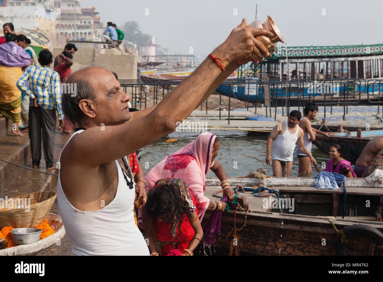 India, Uttar Pradesh, Varanasi, Pilgrim praying at Dashashwamedh Ghat ...