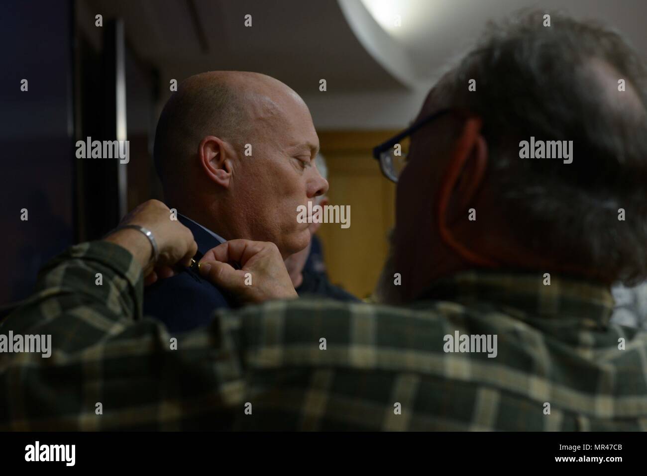 U.S. Air Force Maj. Richard Daigle has his rank pinned by family ...