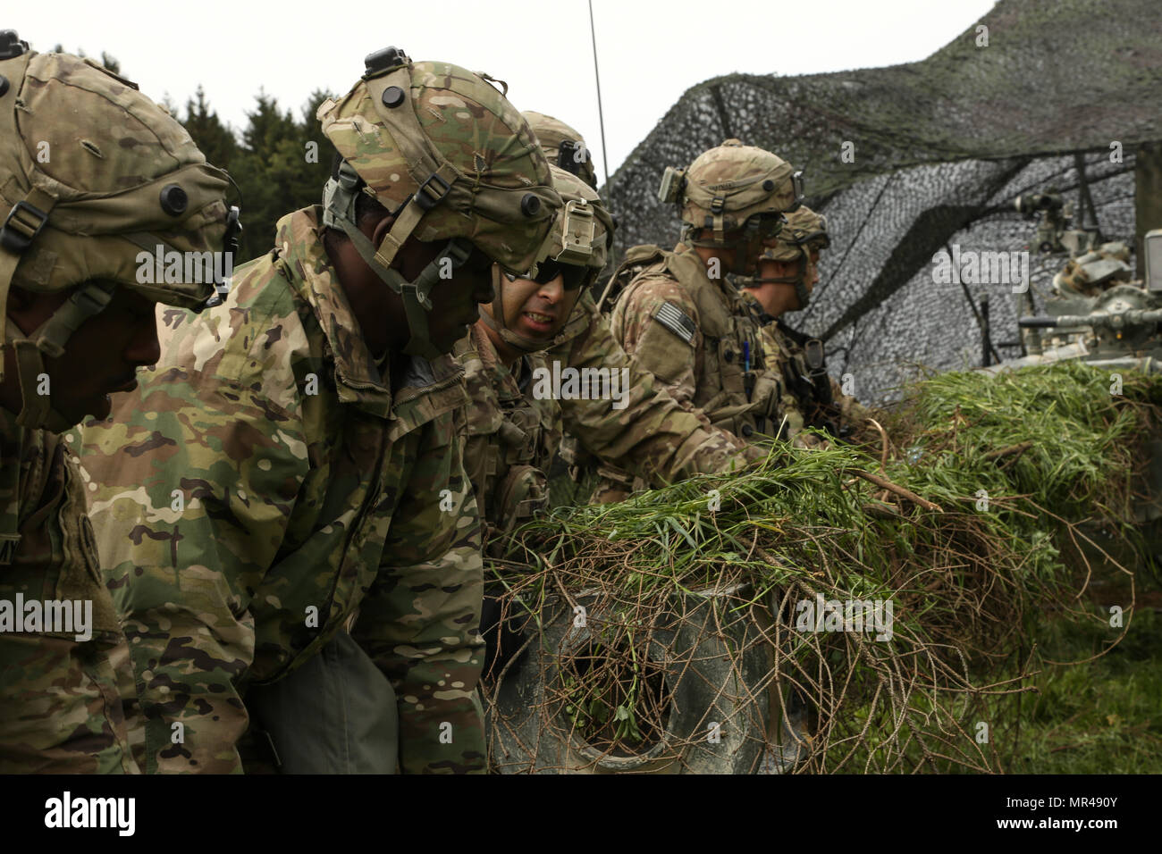 U.S. Soldiers of 2d Cavalry Regiment adjust the sector of fire for a ...