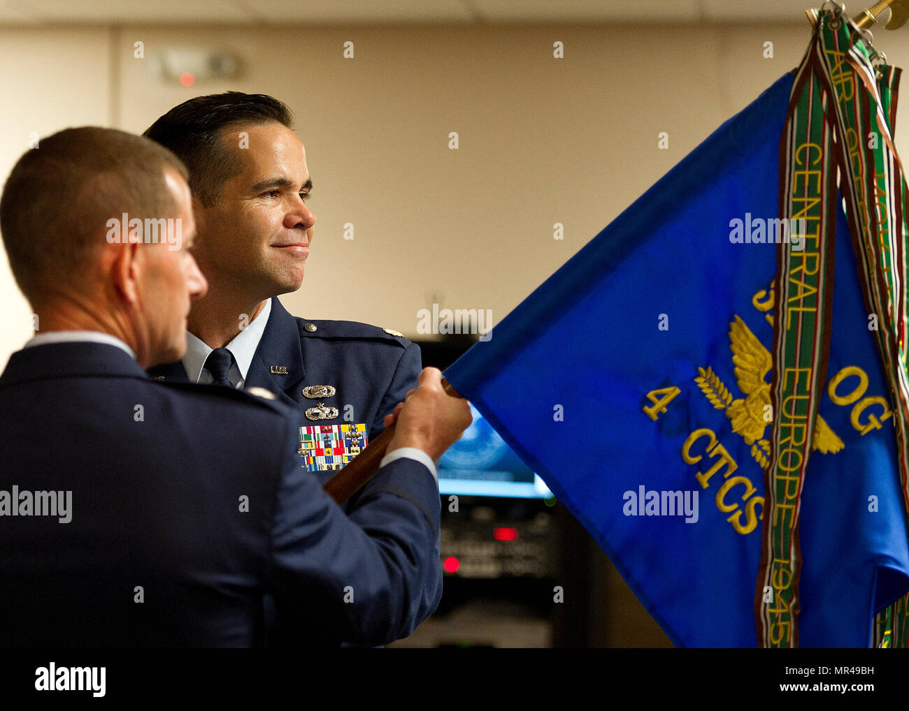 U.S. Air Force Maj. Hamilton Underwood receives the guidon and assumes ...