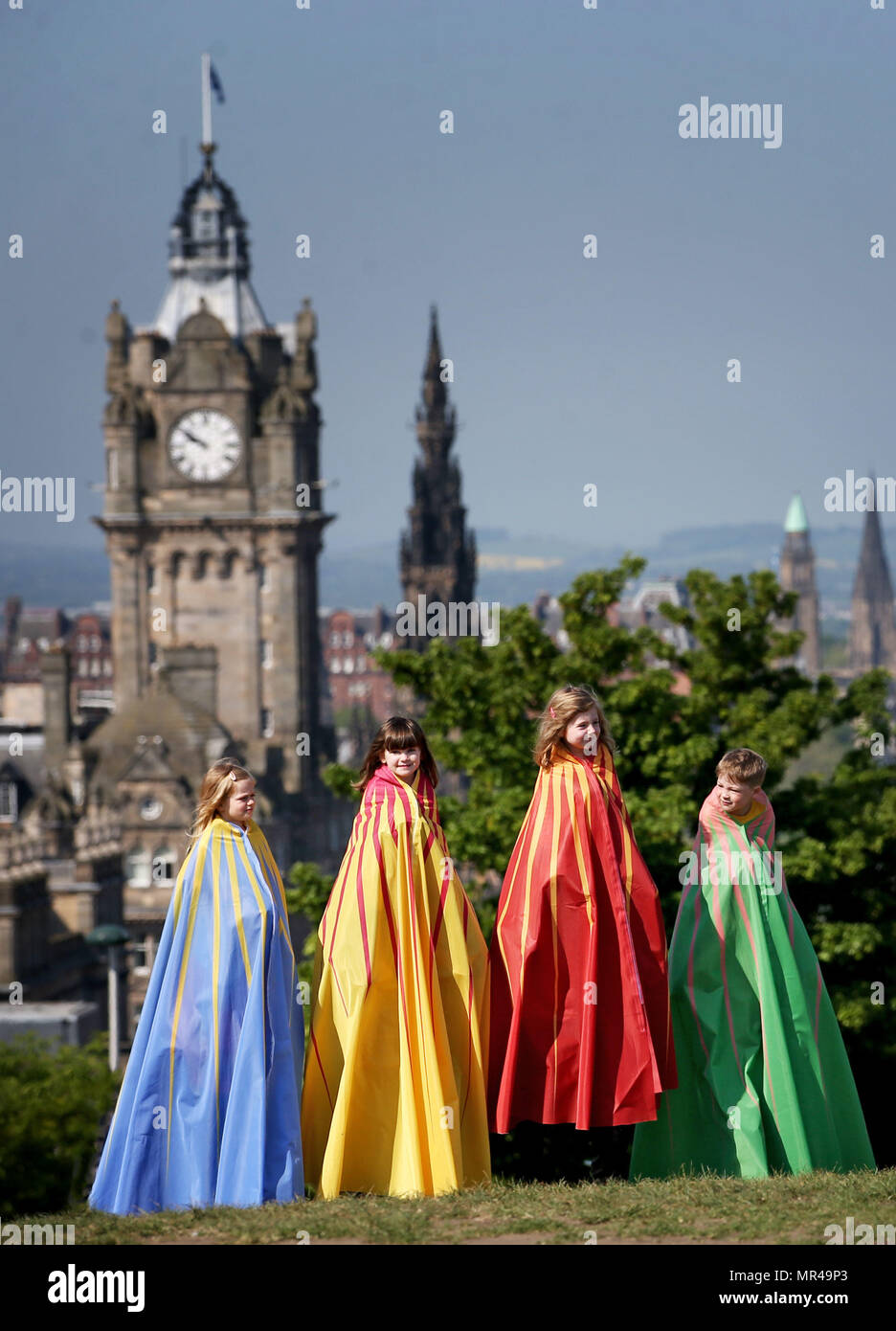 Dressed in giant capes (from left) Sofia Allison, four, Lottie Steel, four, Bella Linehan, five ...