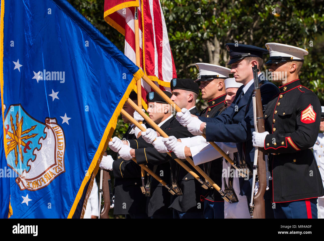 A joint-service color guard brings in the flags at the beginning of the ...