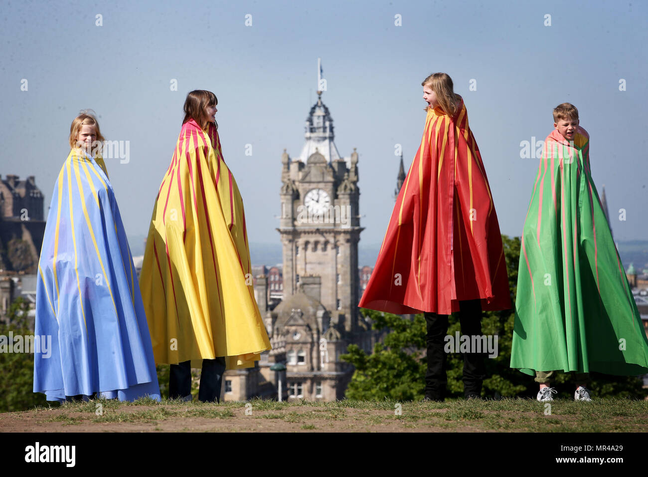 Dressed in giant capes (from left) Sofia Allison, four, Lottie Steel, four, Bella Linehan, five ...