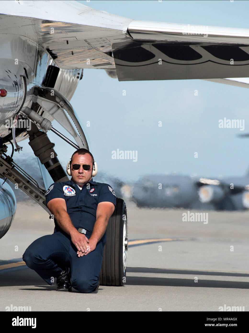 A United States Air Force Thunderbirds crew chief performs a pre-flight ...