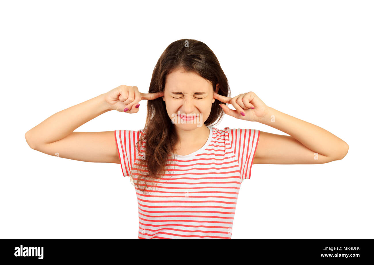 Portrait of angry stressed out young woman plugging ears with fingers ...