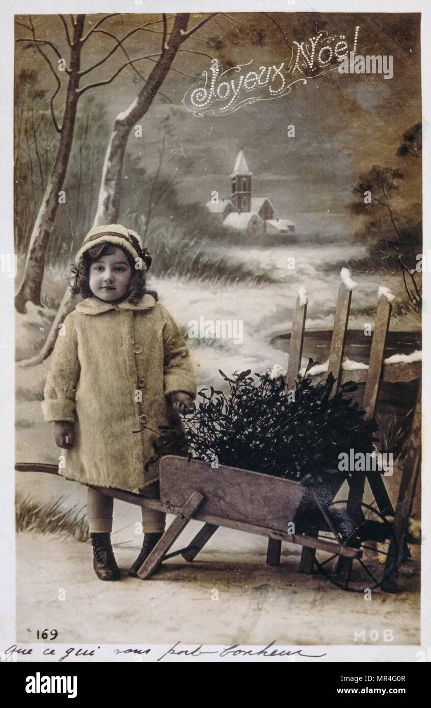 French Christmas card showing a girl against a snow scene 1900 Stock ...