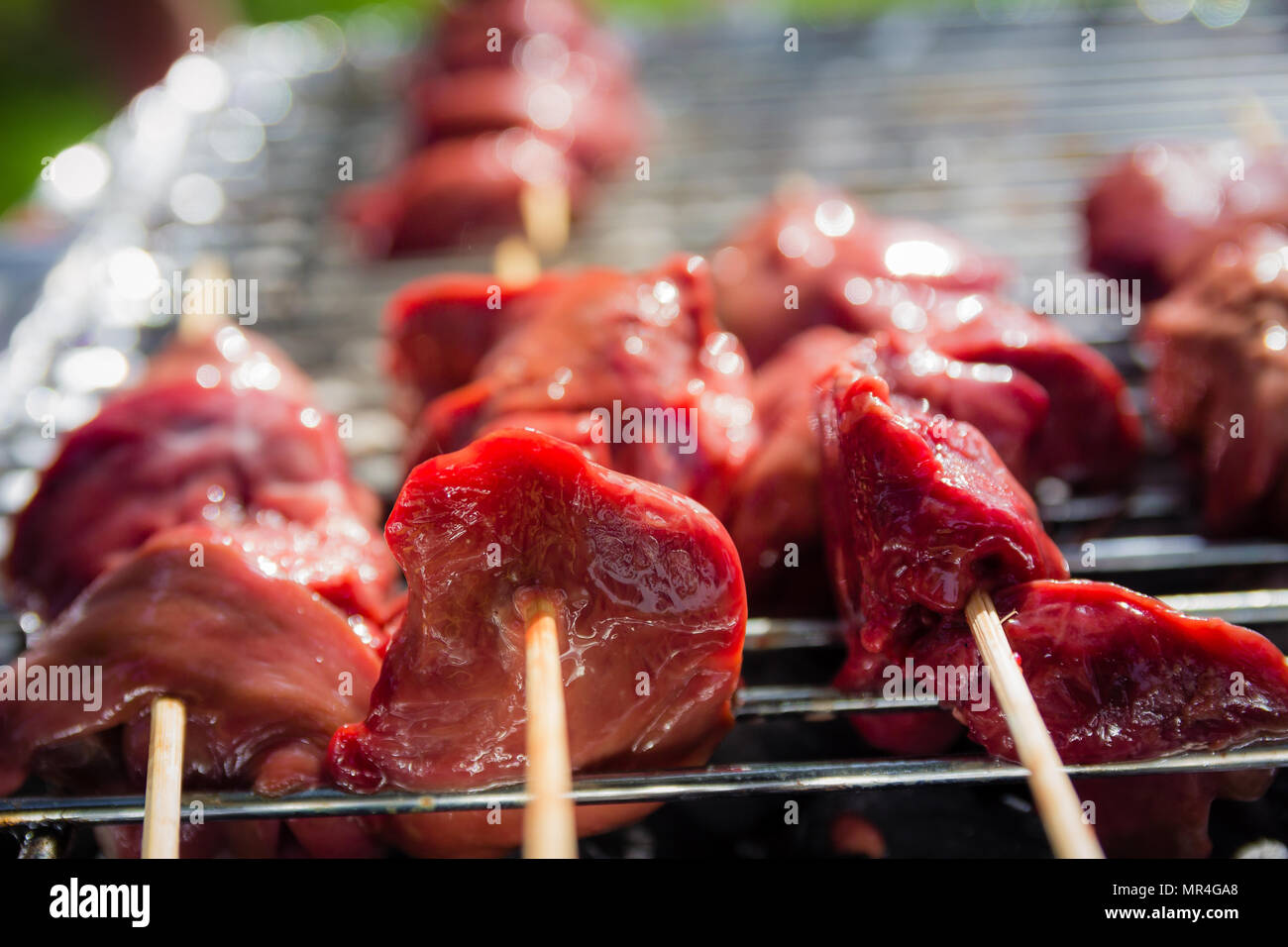 Different types of meat are cooked on the grill - close up Stock Photo ...