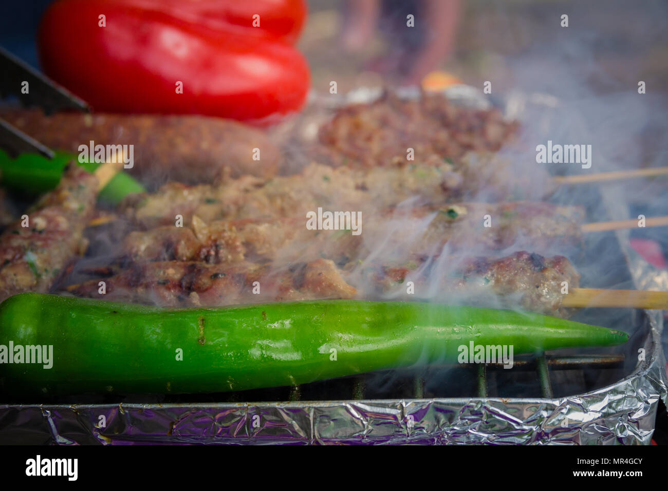 Different types of meat are cooked on the grill - close up Stock Photo ...
