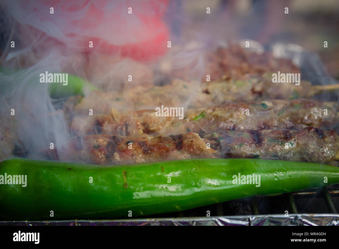 Different types of meat are cooked on the grill - close up Stock Photo ...