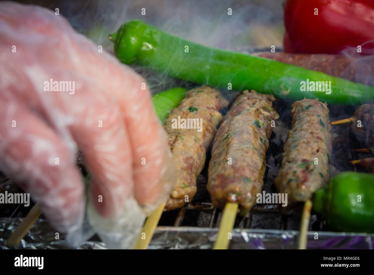 Different types of meat are cooked on the grill - close up Stock Photo ...