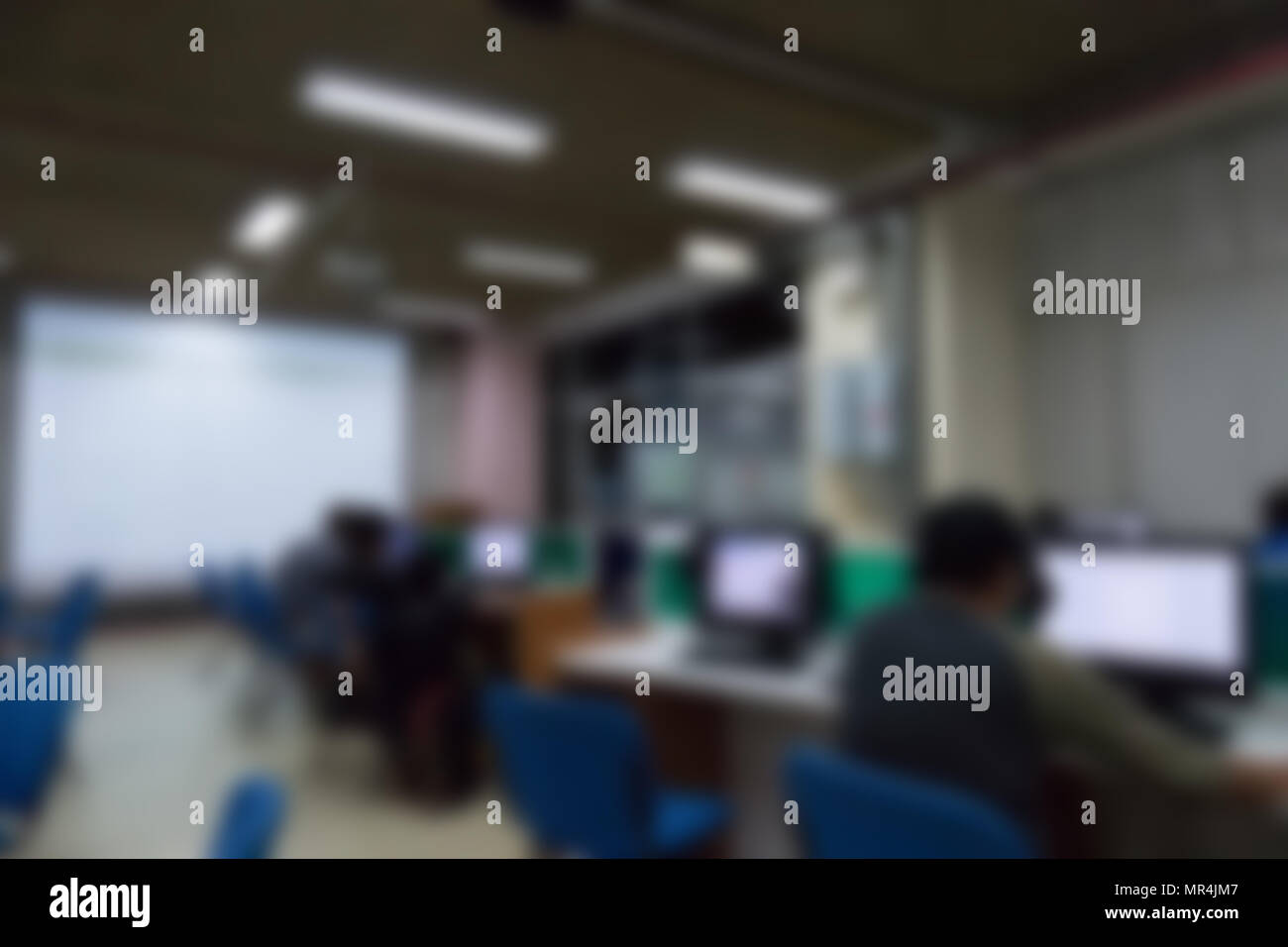 student learning & researching online in computer room in university ...