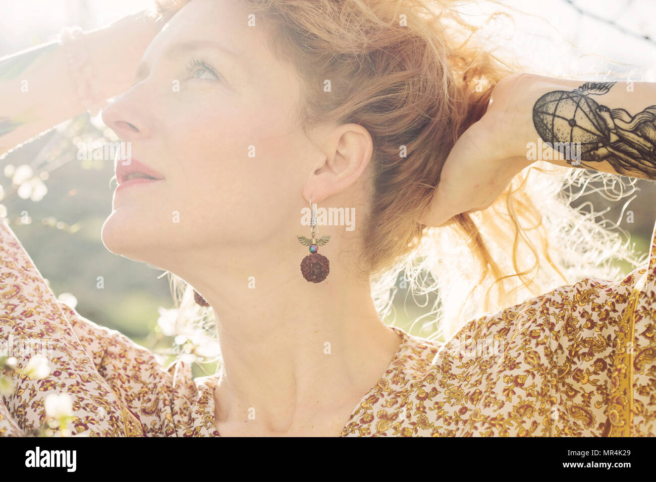 Beautiful woman in spring light garden Stock Photo - Alamy