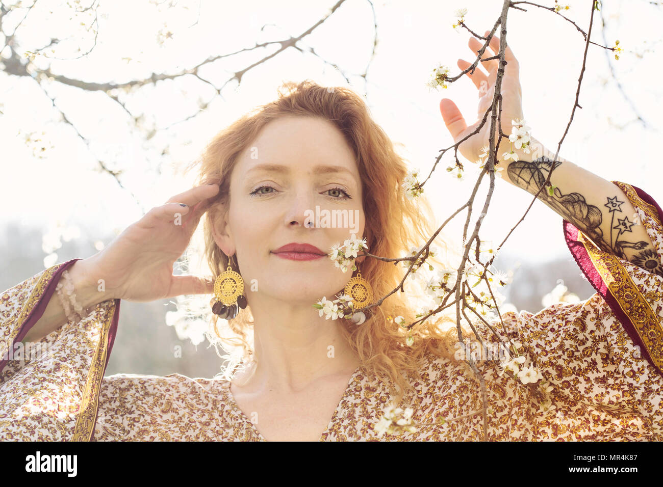 Beautiful woman in spring light garden Stock Photo - Alamy