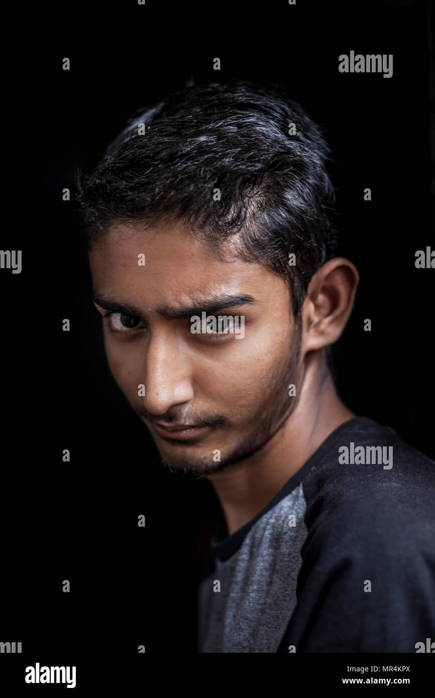 Portrait of a young teenager annoyed or angered on some thing poses in ...