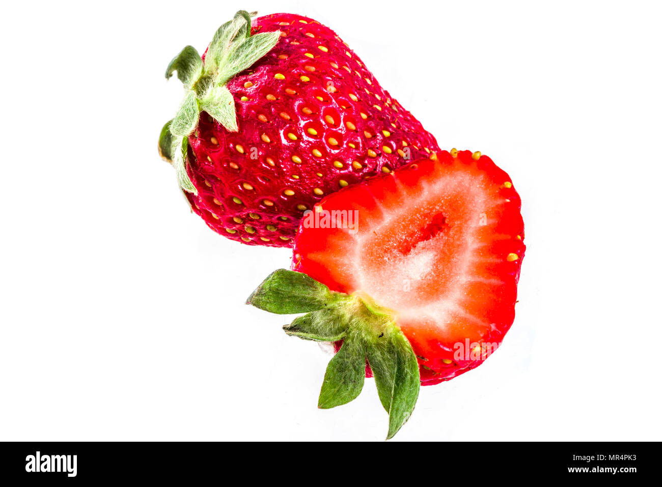 Ripe raw whole and sliced organic strawberry, isolated on white ...