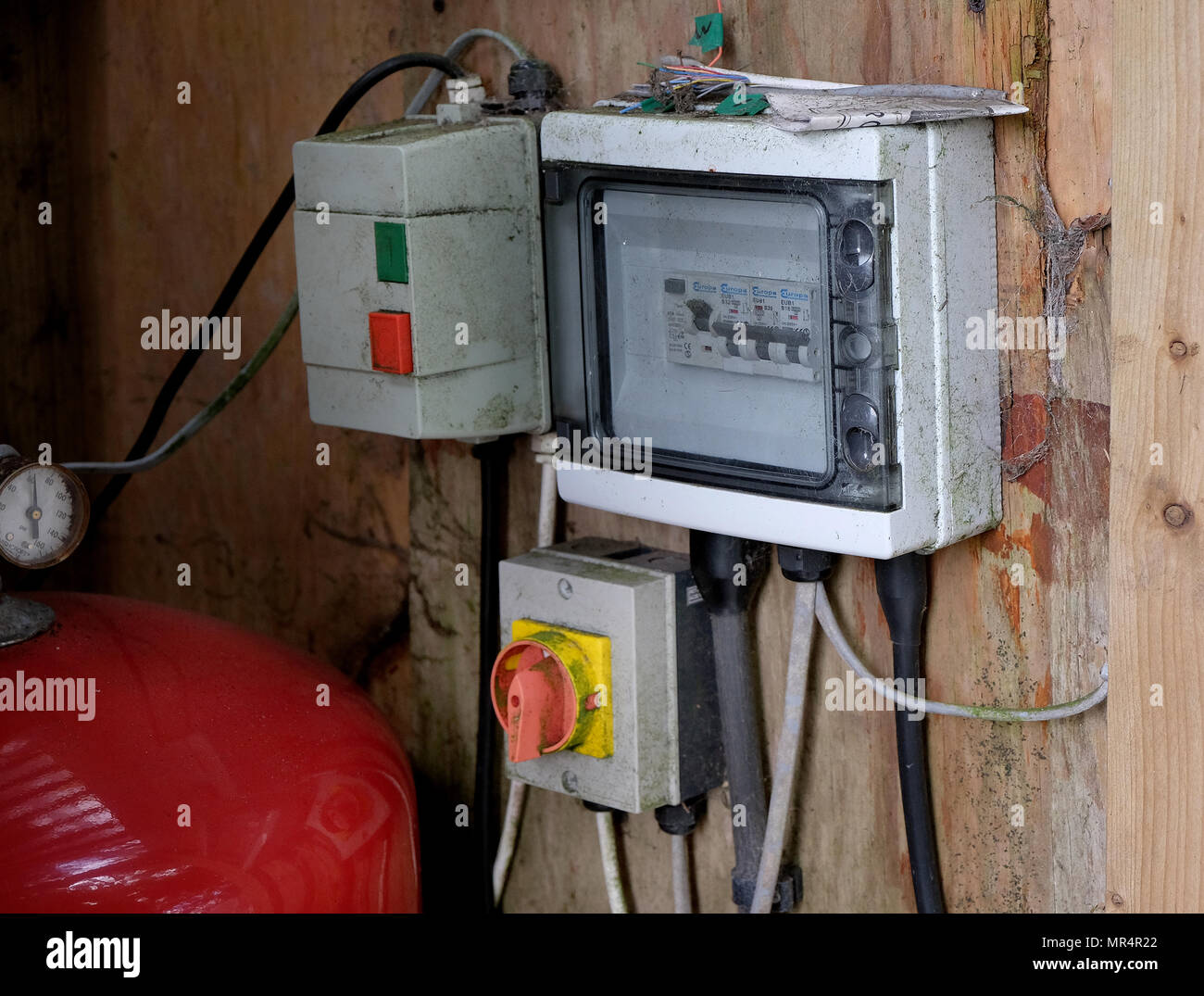 Electric equipment in open wooden shed outdoors Stock Photo - Alamy
