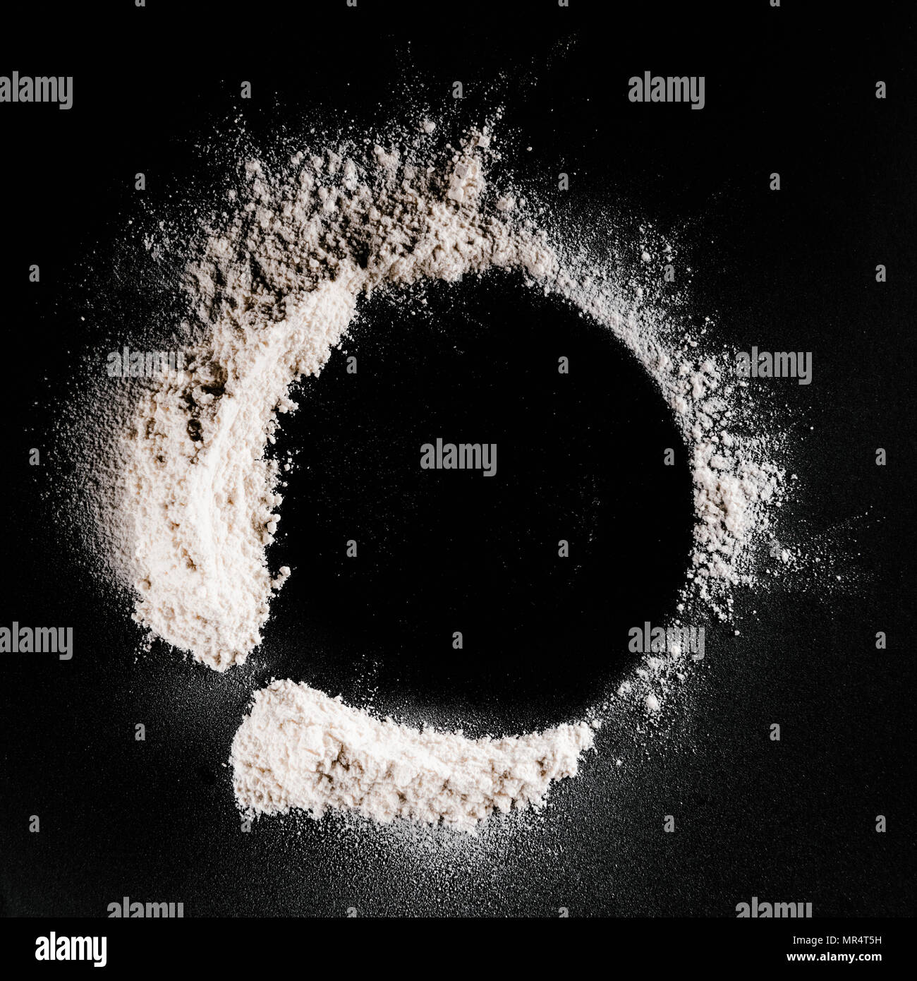 top view of flour on black surface Stock Photo - Alamy