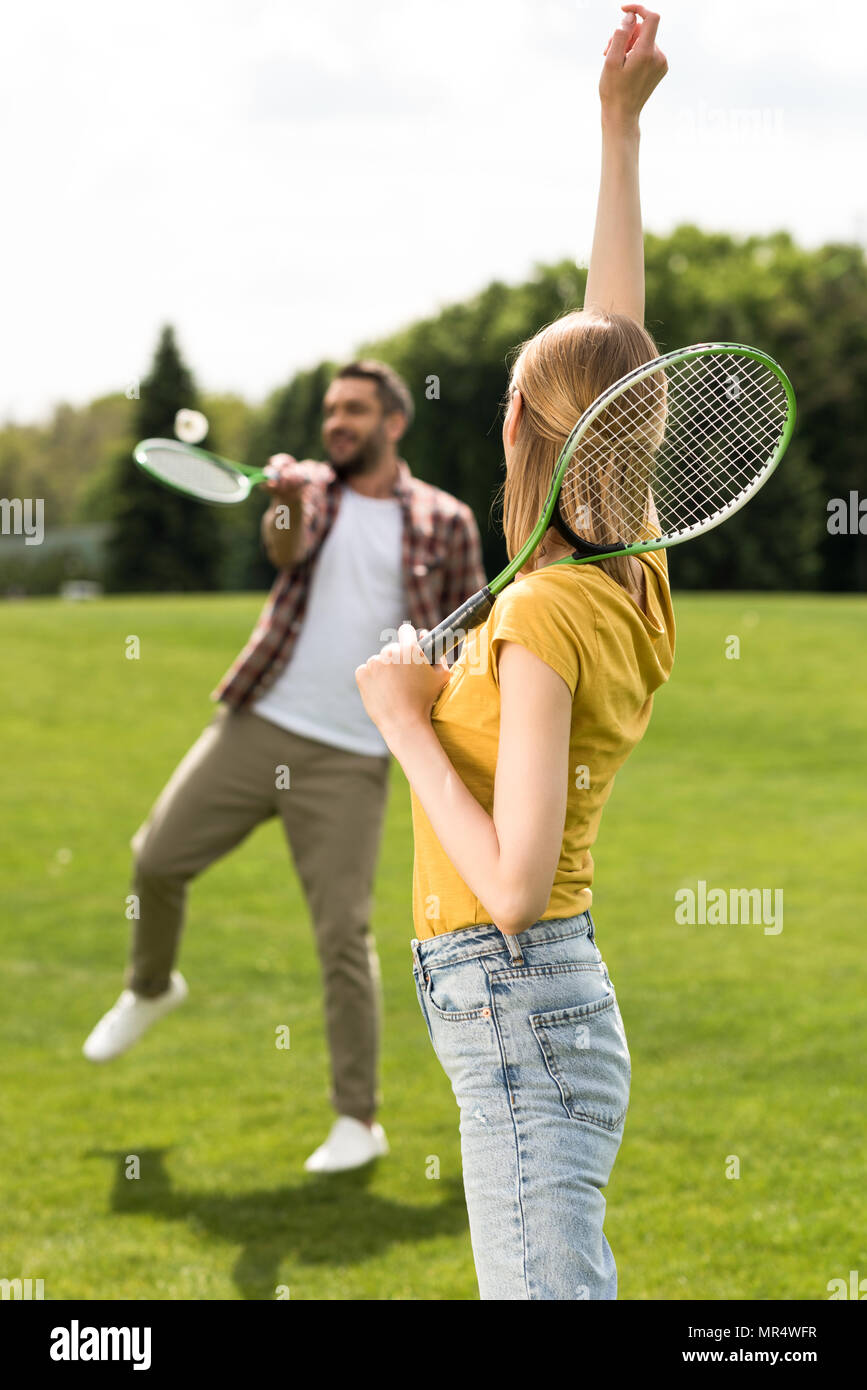 Happy young couple playing badminton hi-res stock photography and ...