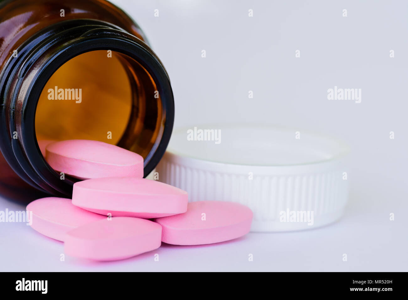 Pills bottle health tablets painkiller medicine cure pink hi-res stock ...