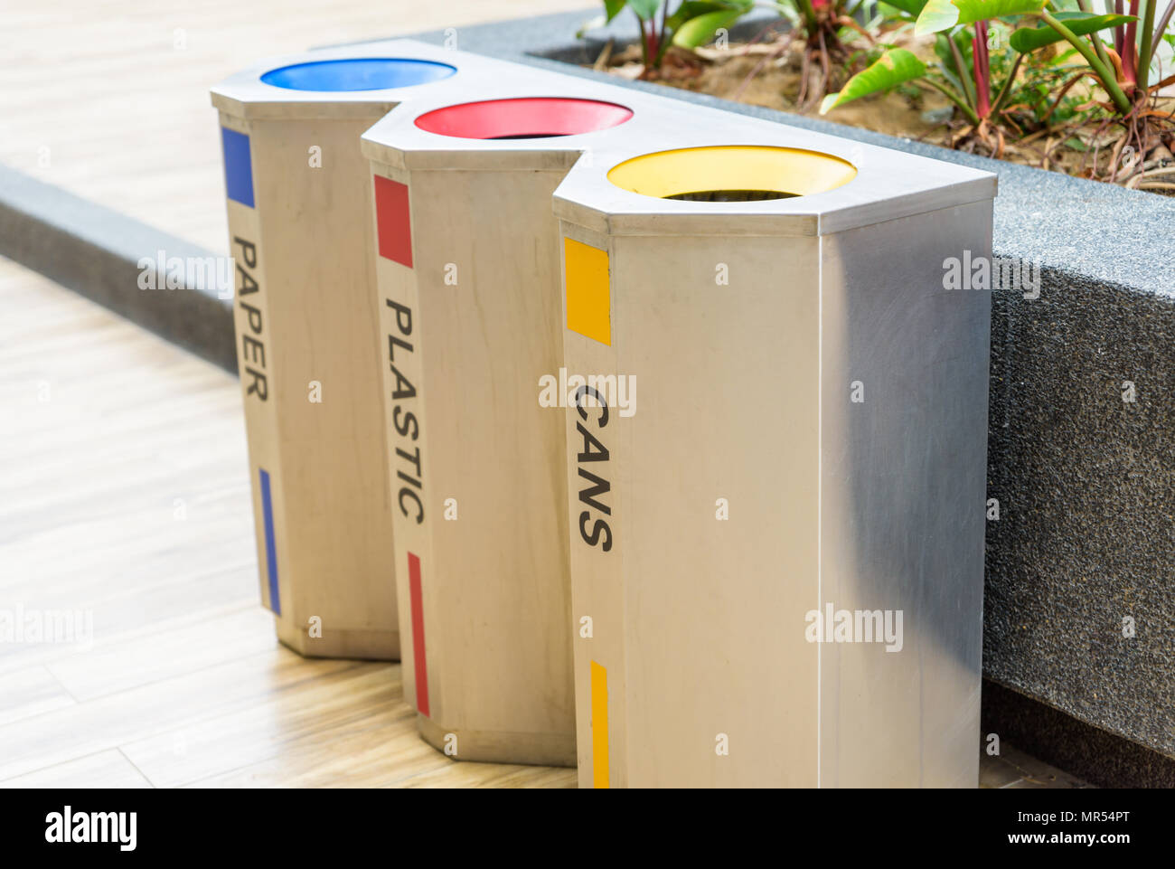Three color trashs separates each type of garbage Stock Photo - Alamy