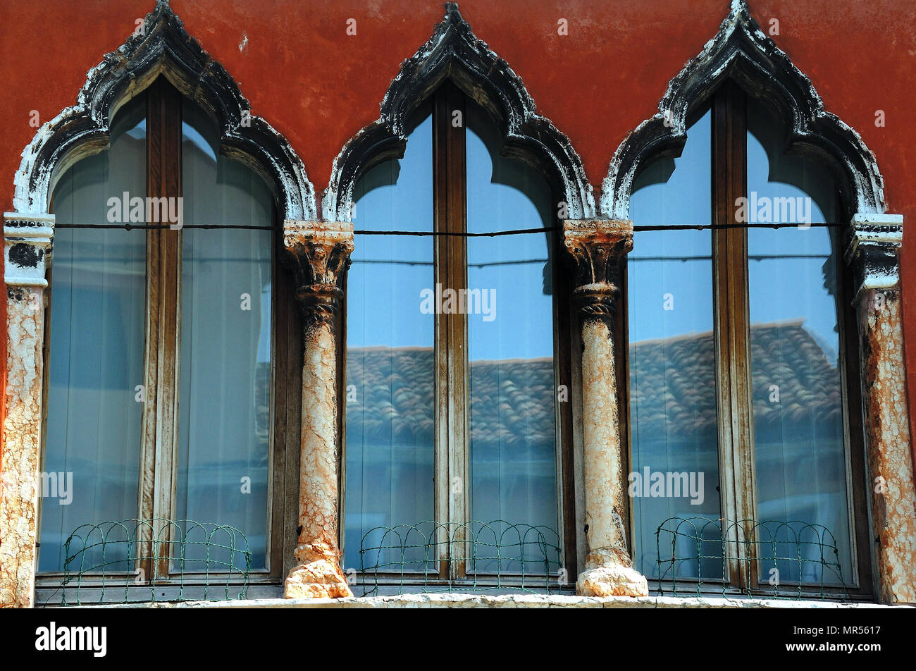 Venice Lagoon, window with three lights in Murano. Murano is formed by ...