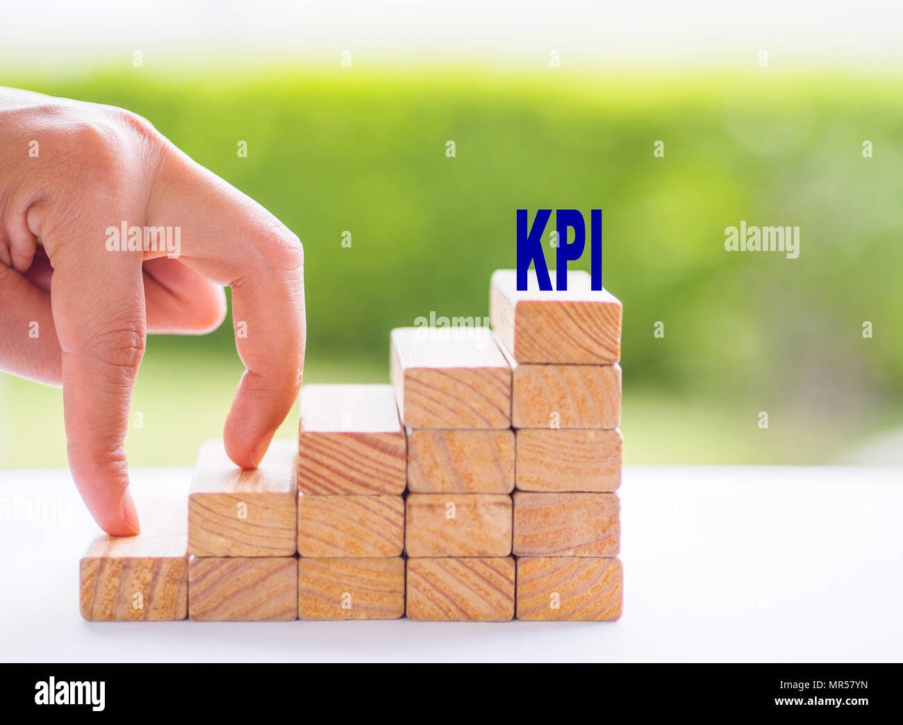 Business achievement, KPI growth concept. Women hand finger walk on ...