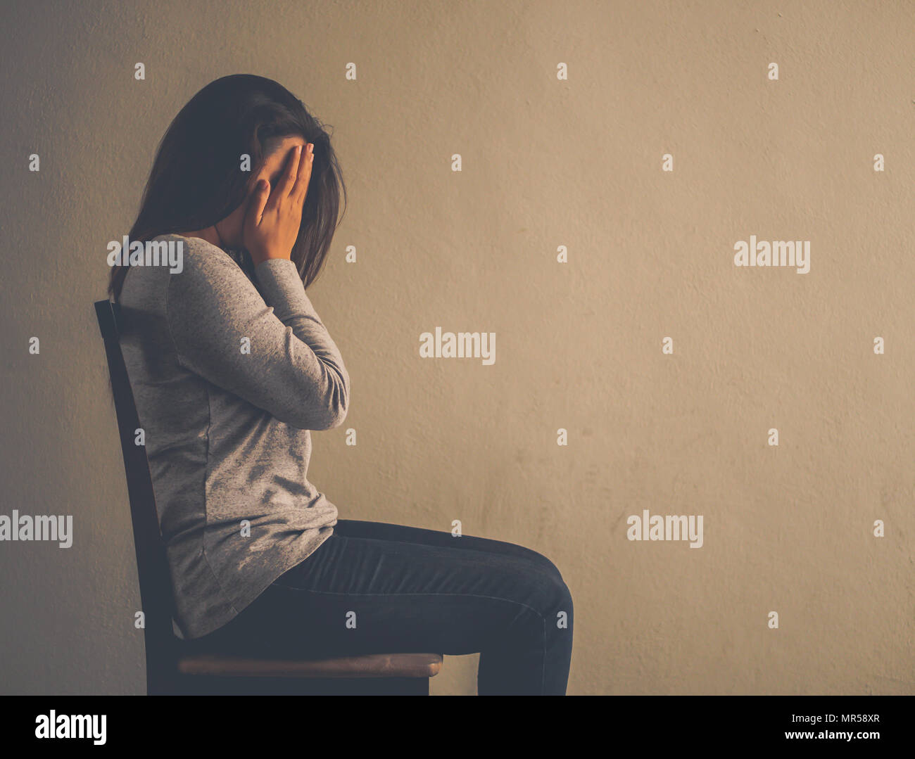 Teenager sitting down in chair hi-res stock photography and images - Alamy