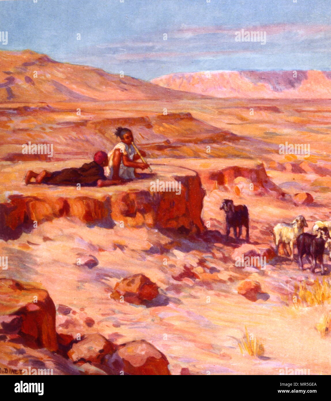 two Arab Nomad children playing a flute while watching goats in the ...