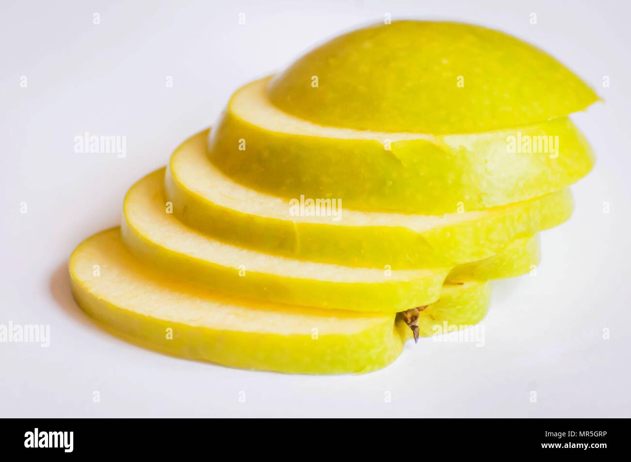 Green apple slices placed as a ladder stock image. Curative fasting ...