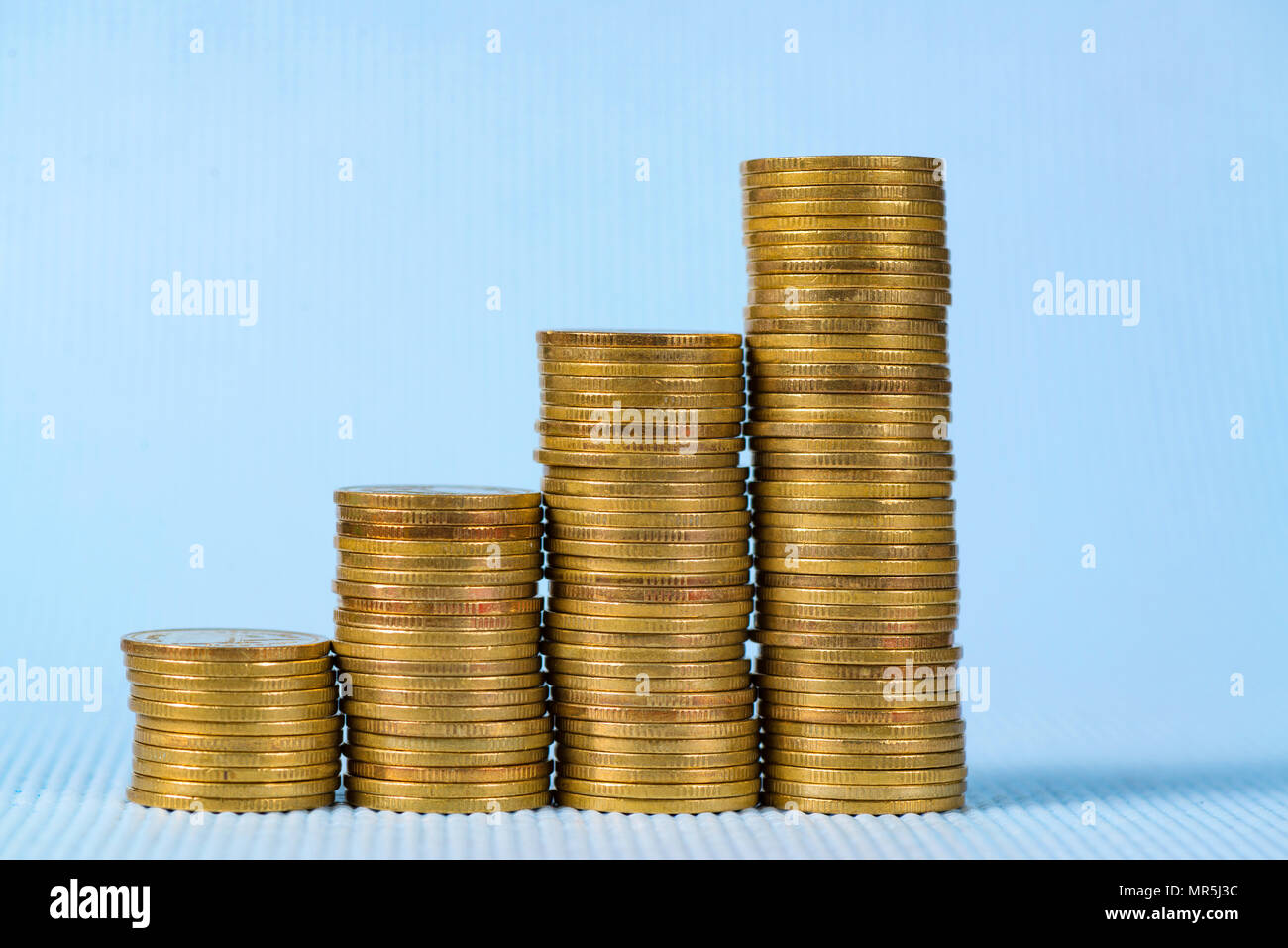 Increasing columns of coins, step of stacks coin with copy space for ...