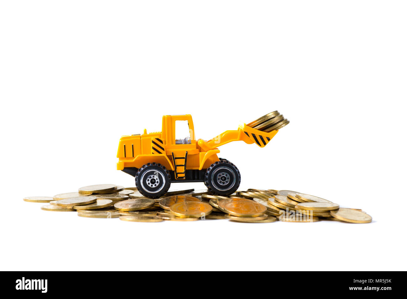 Mini bulldozer truck loading stack coin with pile of gold coin ...