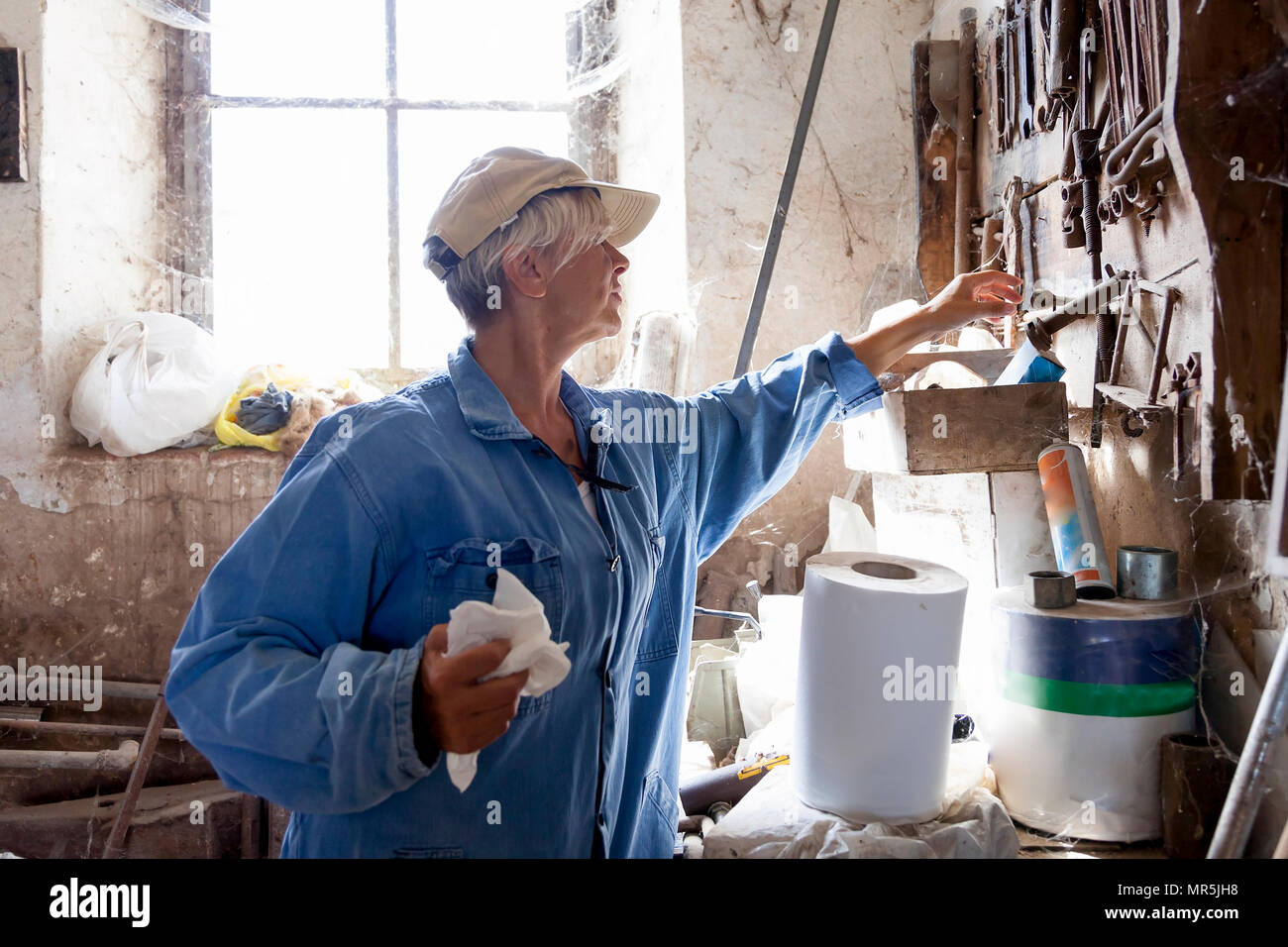 beautiful lady at work in his old workshop Stock Photo - Alamy