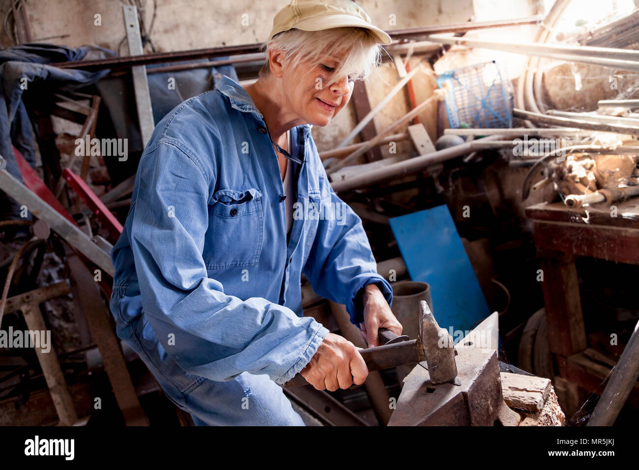 beautiful lady at work in his old workshop Stock Photo - Alamy
