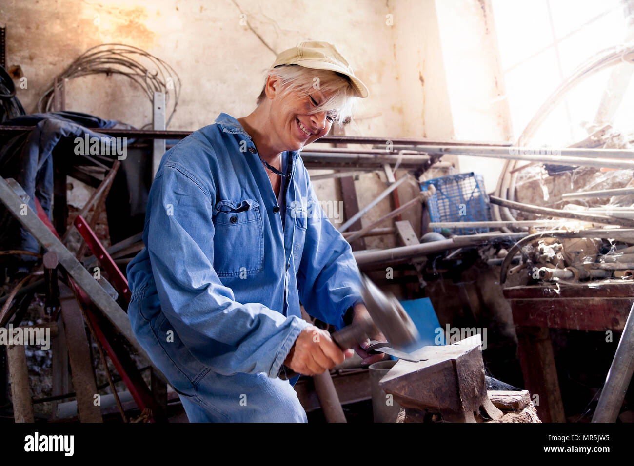 beautiful lady at work in his old workshop Stock Photo - Alamy