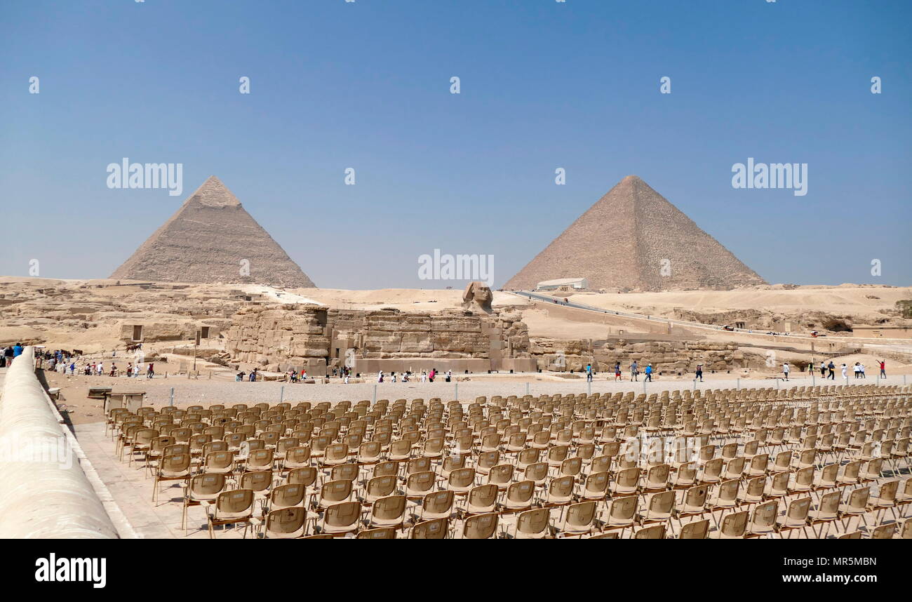 The Great Sphinx of Giza set against the Pyramid of Khufu. limestone ...