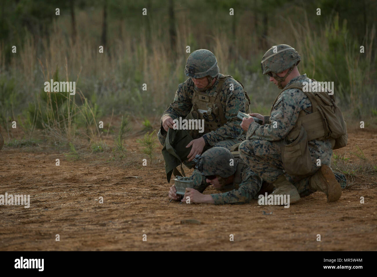 Marines emplace an M18 Claymore anti-personnel mine during a ...