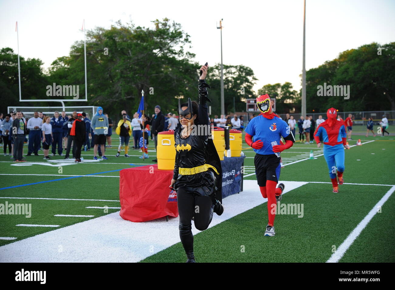 Team Robins Wingman Day kicked off with Super Hero Run at the Football ...