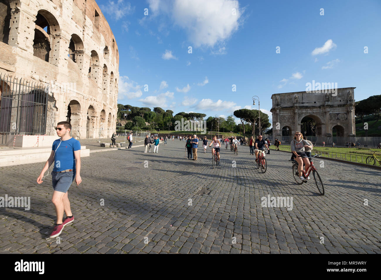 Rome Coliseum scene, tourists walking and visiting the roman ...