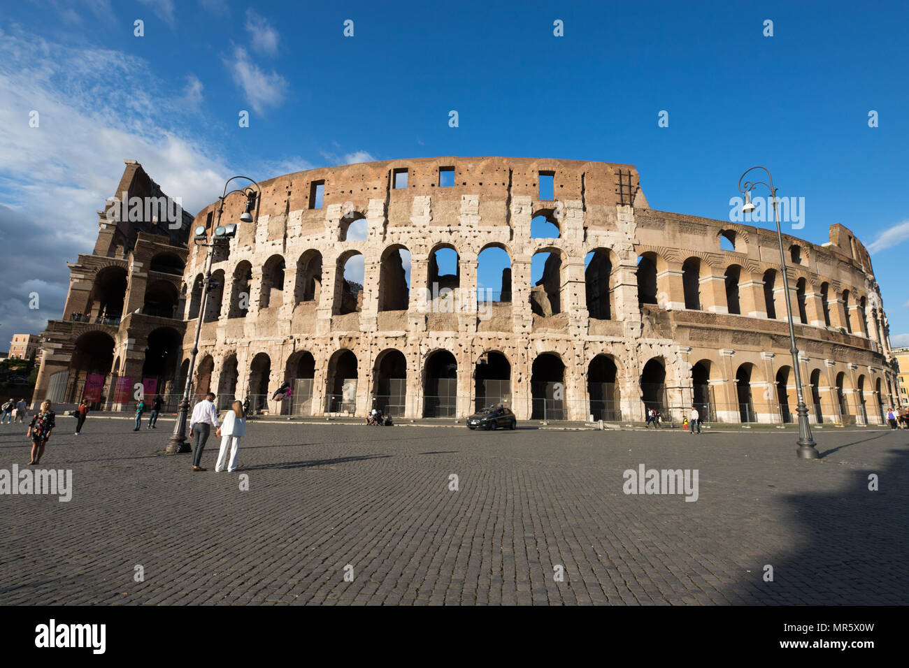 Rome Coliseum scene, tourists walking and visiting the roman ...