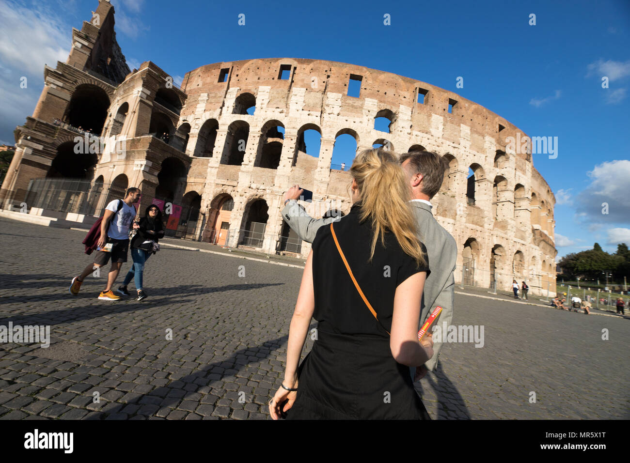 Rome Coliseum scene, tourists walking and visiting the roman ...