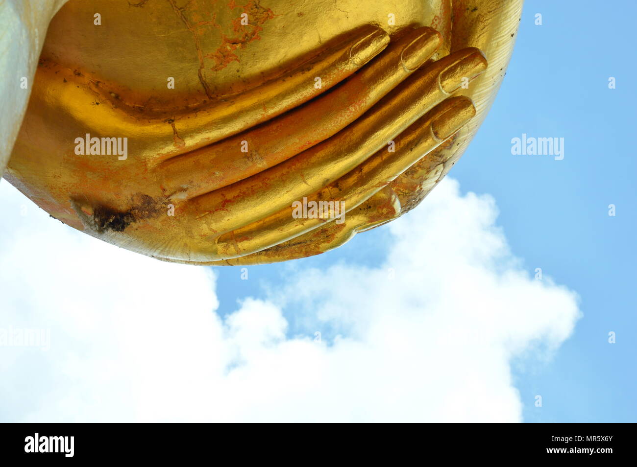 golden Buddha hand hold an alms bowl Stock Photo - Alamy