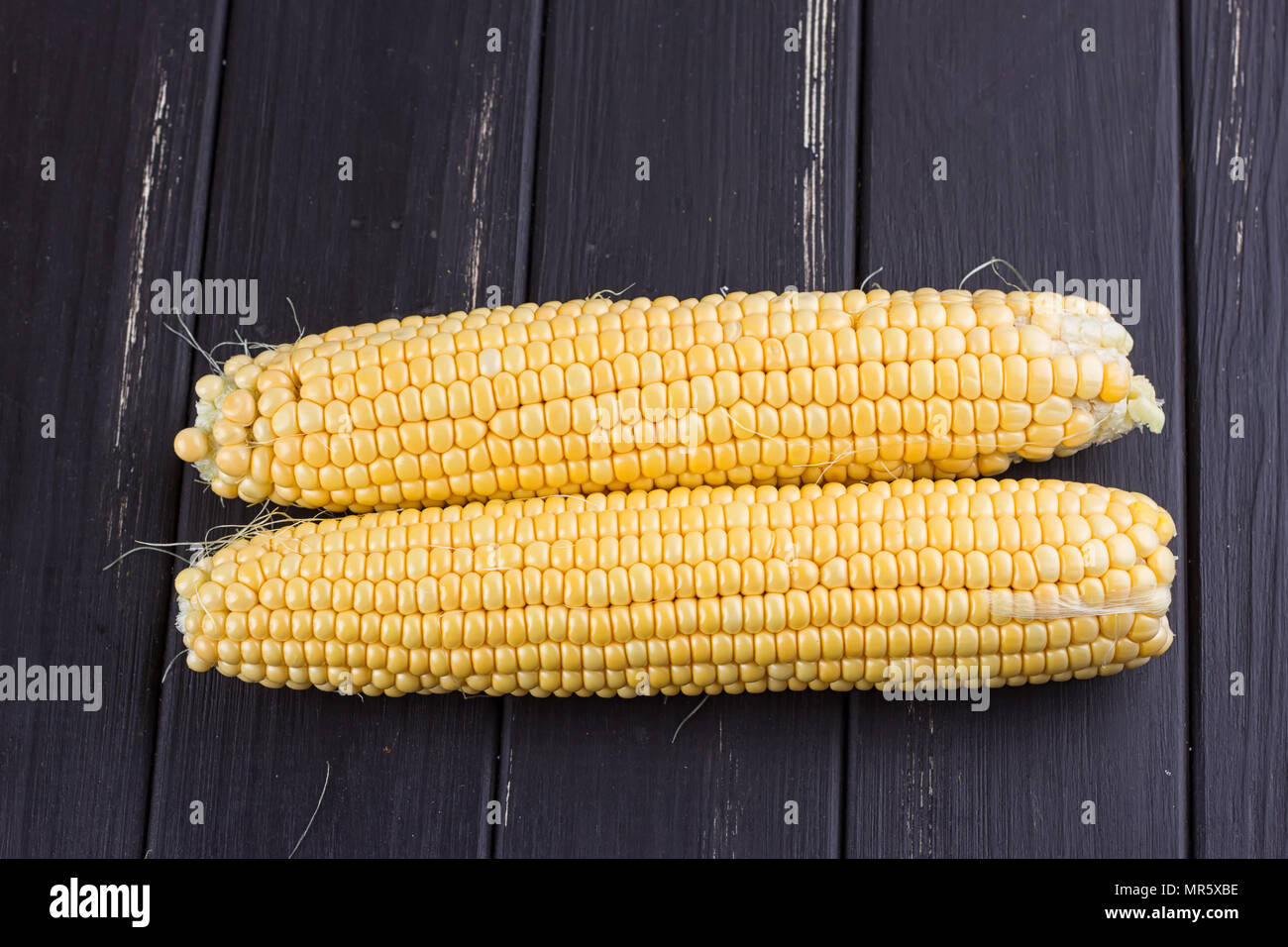 Raw ear corn on black hi-res stock photography and images - Alamy