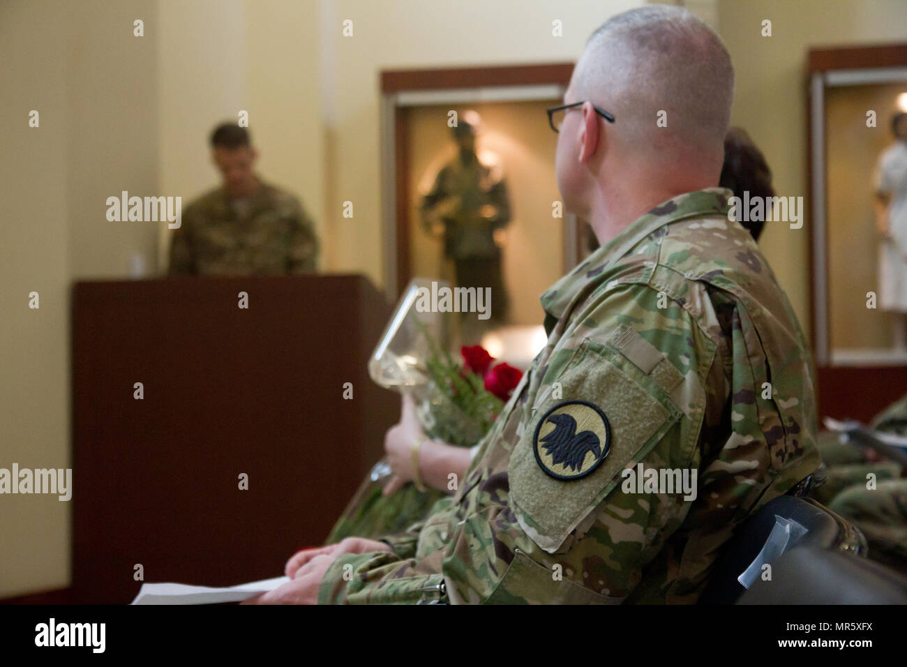 Maj. Jeffrey Engle listens to remarks by Lt. Col. Brian Hoffman, the ...