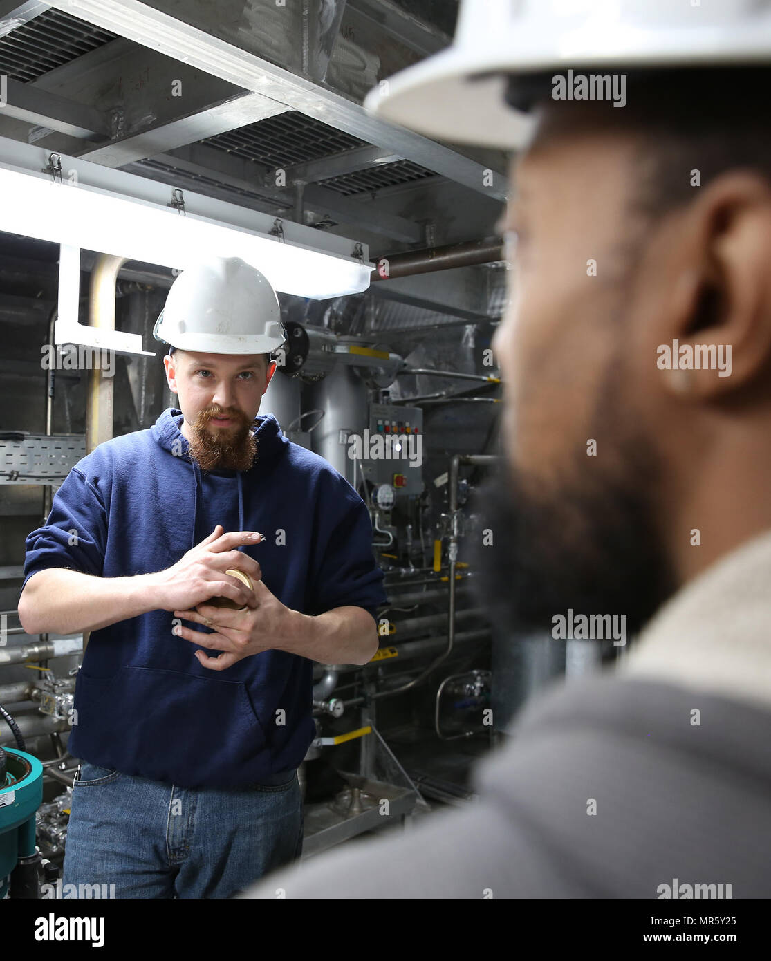 Morris Williams, USNS Trenton first engineer, provides guidance as ...
