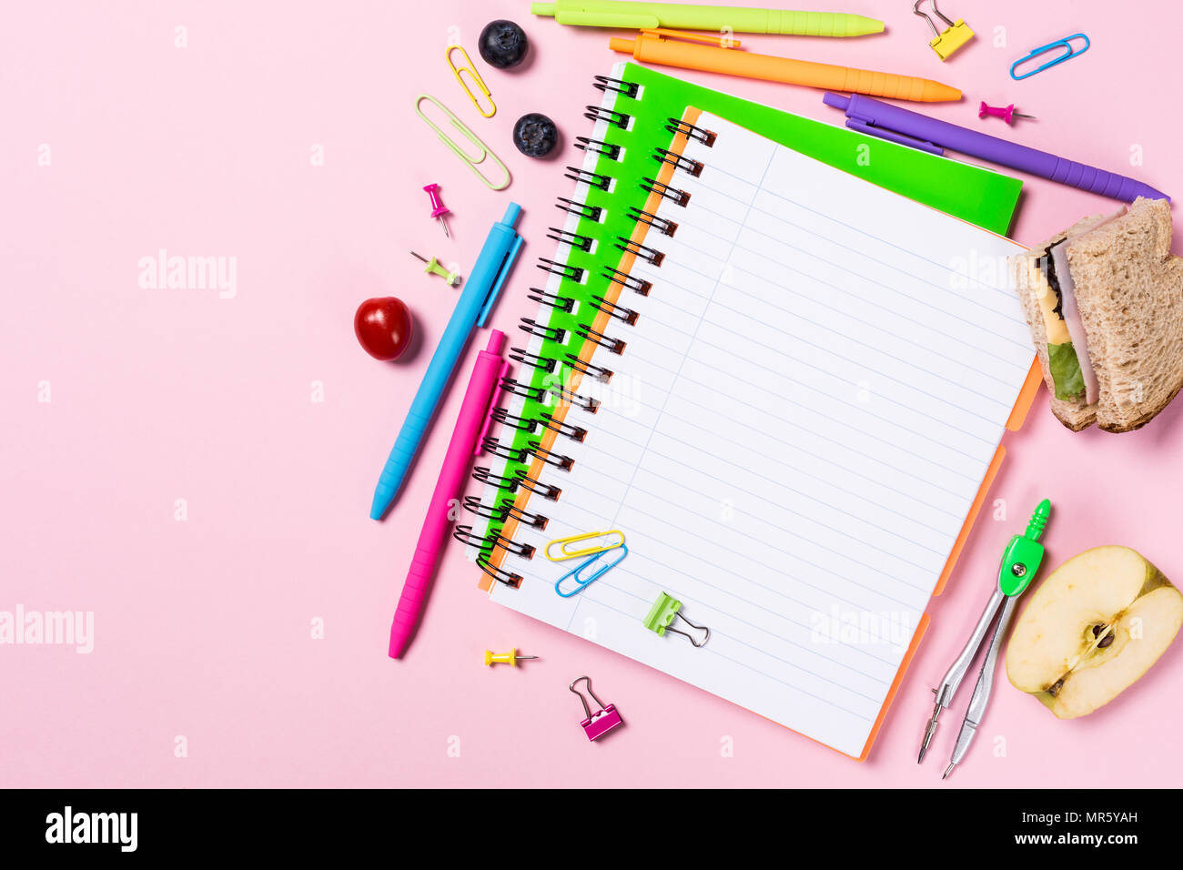 School background with notebooks and colorful supplies Stock Photo - Alamy